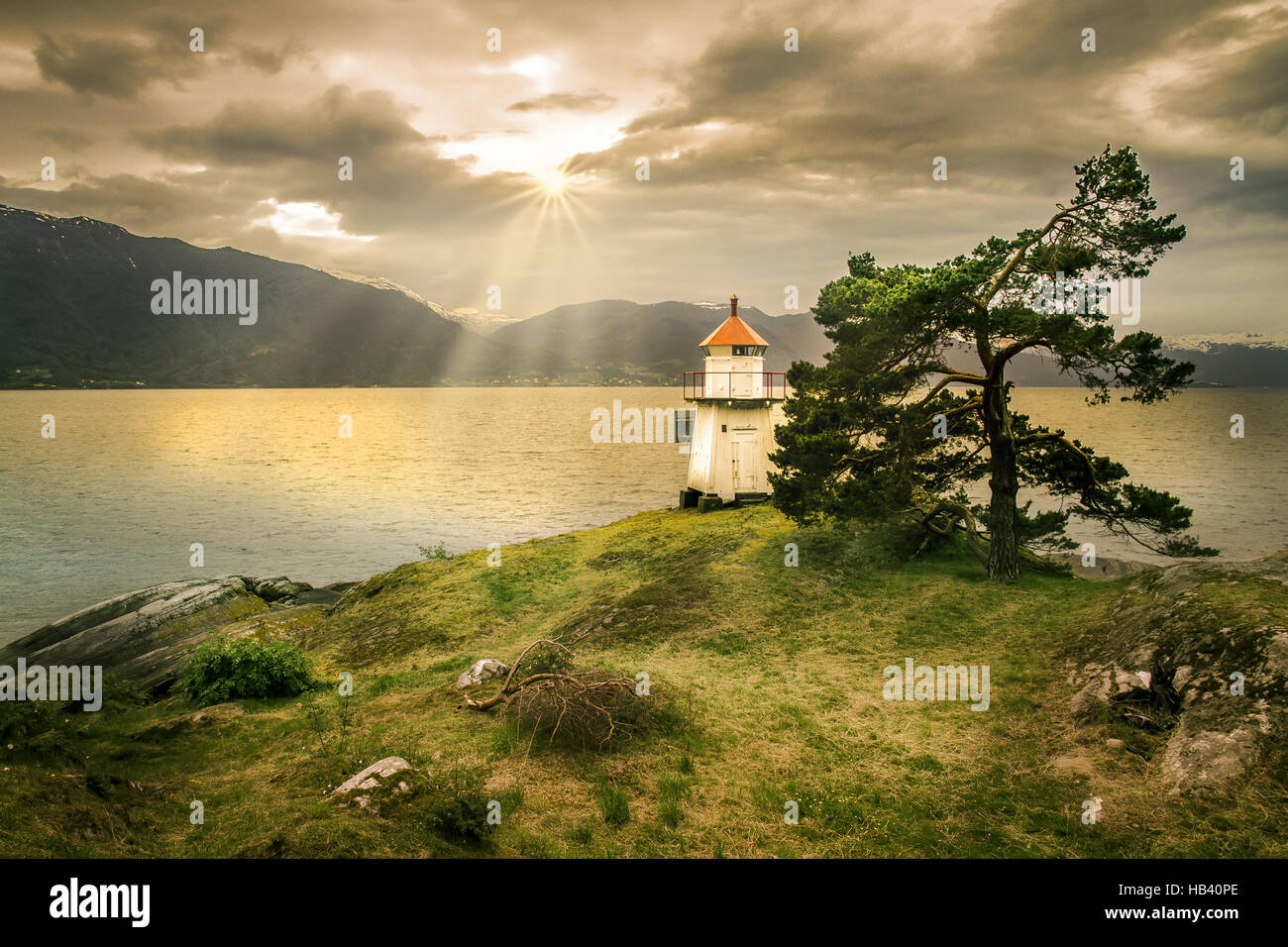 lighthouse and sun Stock Photo - Alamy