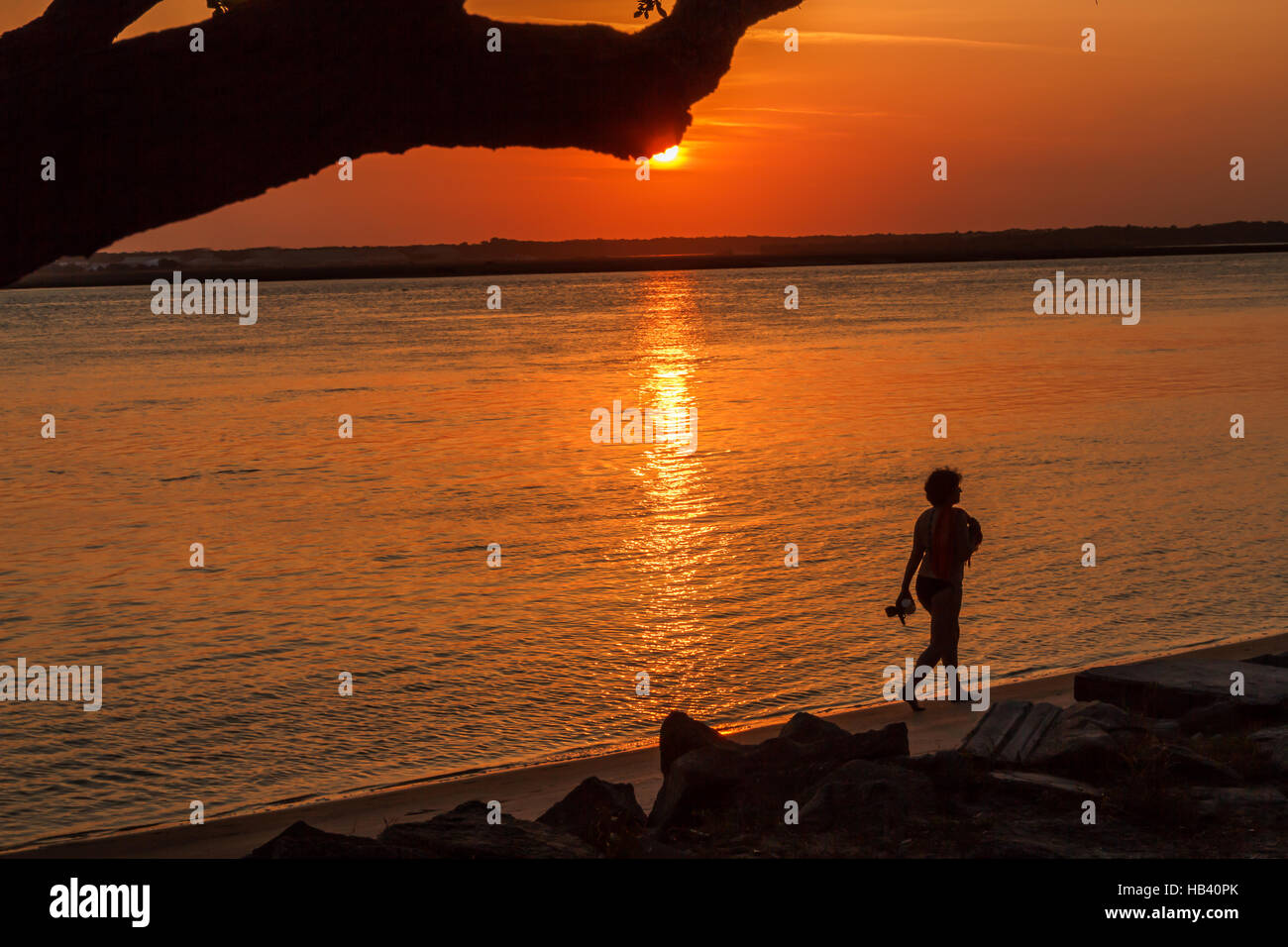 A walk along the beach at sunset Stock Photo - Alamy