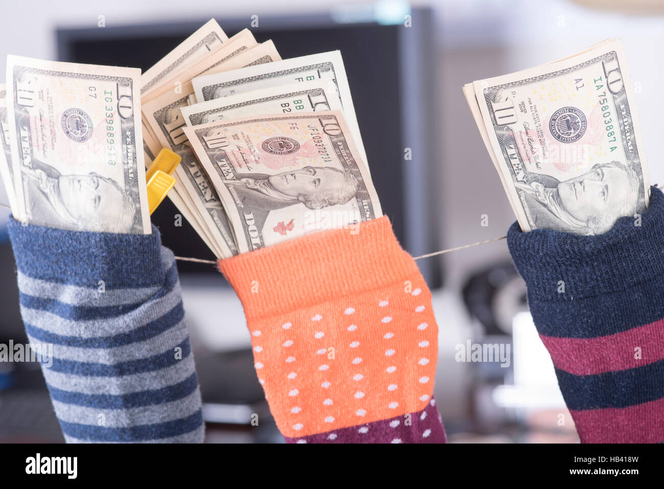 dollar savings hidden in a sock Stock Photo - Alamy