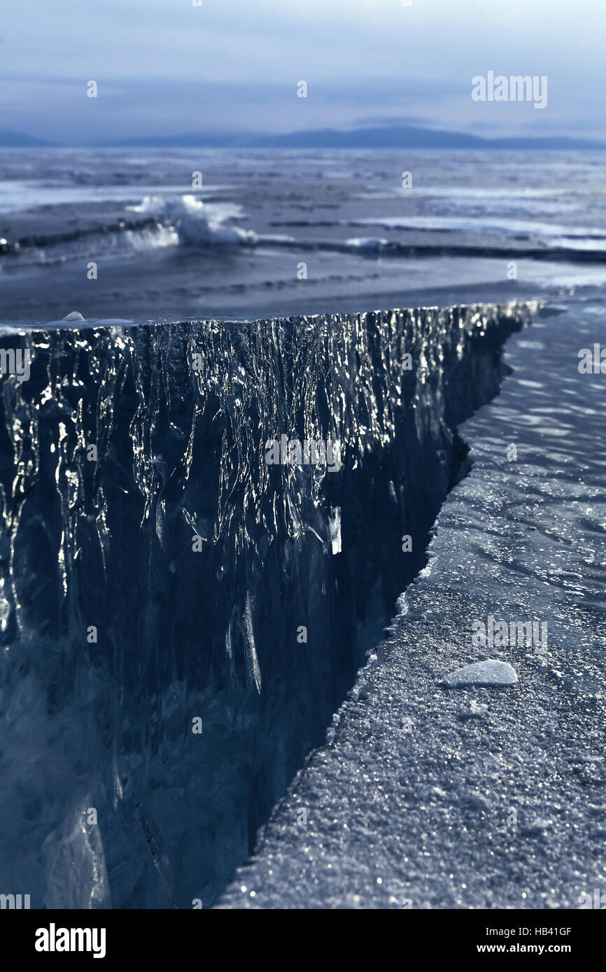 Large cracks on surface of the ice Stock Photo - Alamy