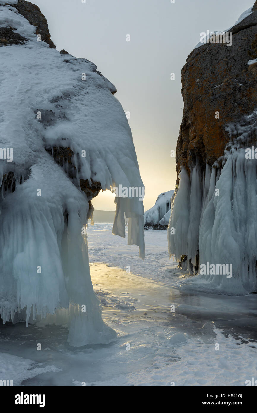 Beautiful icicles on rocks at sunrise Stock Photo - Alamy