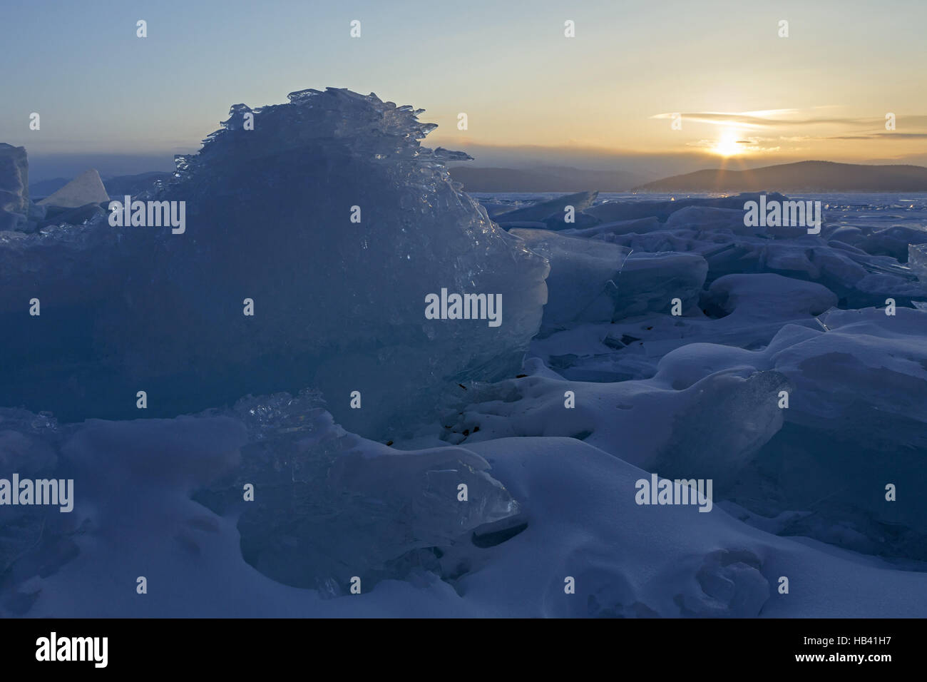 Ice dragon looking at the rising sun Stock Photo - Alamy