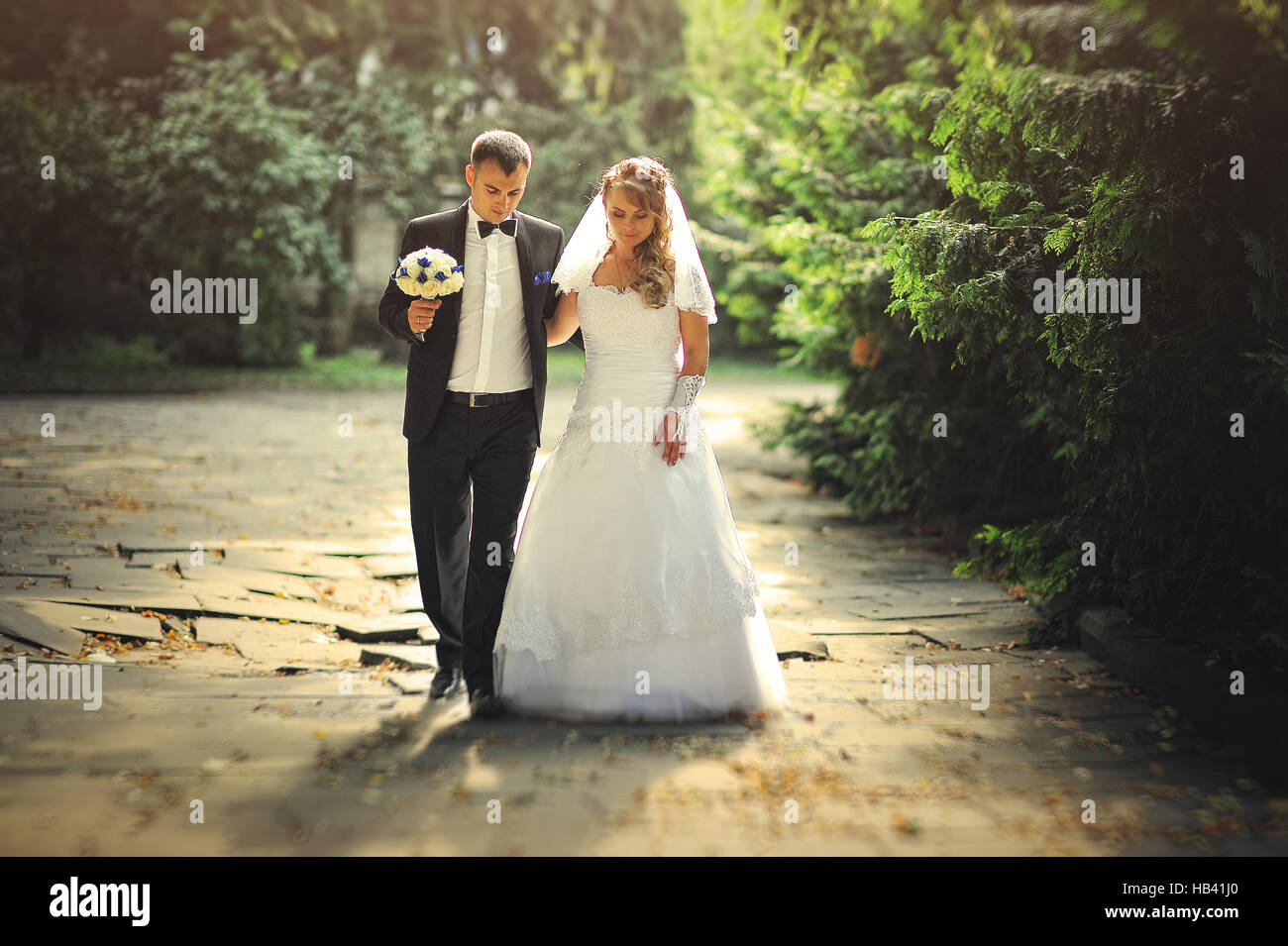 Woman in wedding dress walking hi-res stock photography and images - Alamy