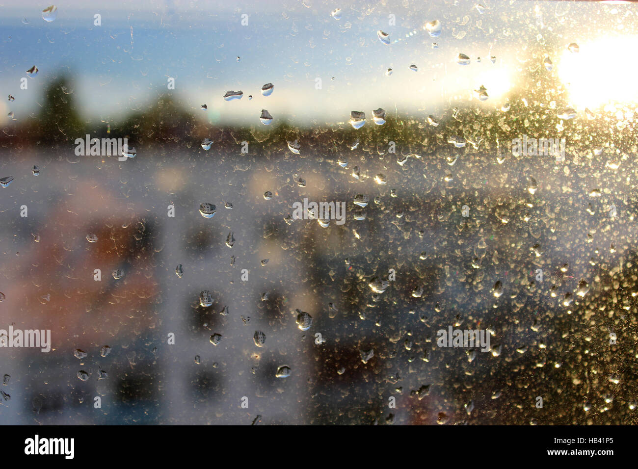 it's raining behind the window in the city Stock Photo - Alamy