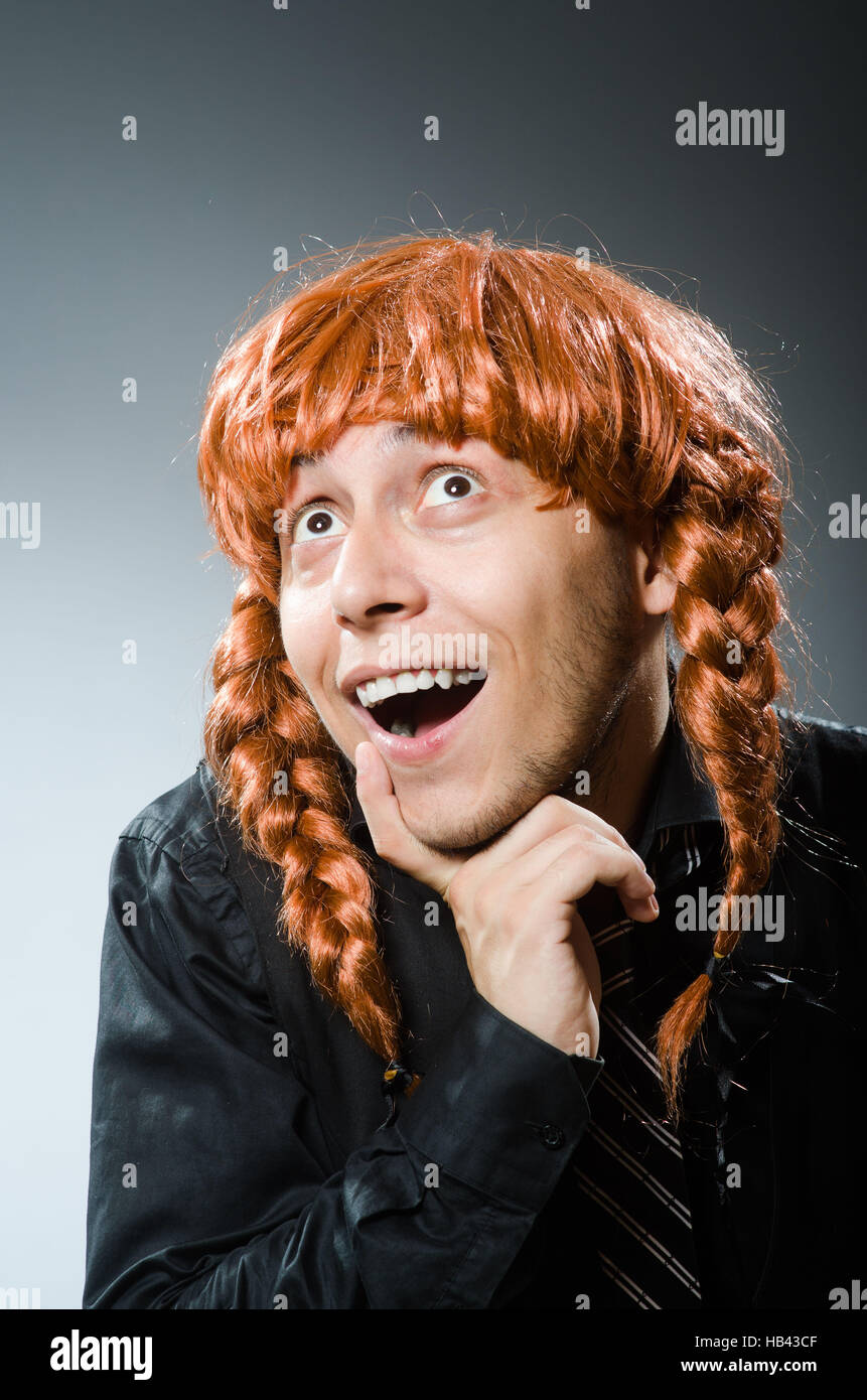Funny man with red hair wig Stock Photo - Alamy