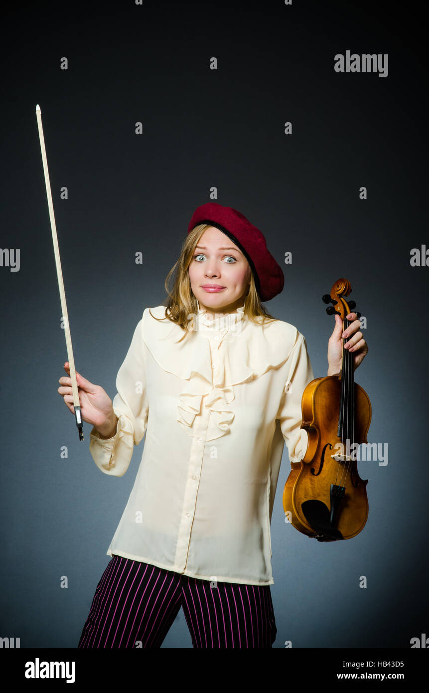 Woman violin player in musical concept Stock Photo - Alamy