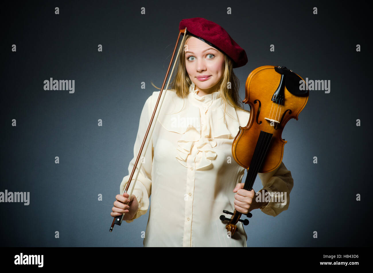 Woman violin player in musical concept Stock Photo - Alamy