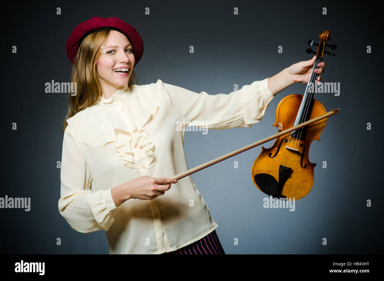 Woman violin player in musical concept Stock Photo - Alamy