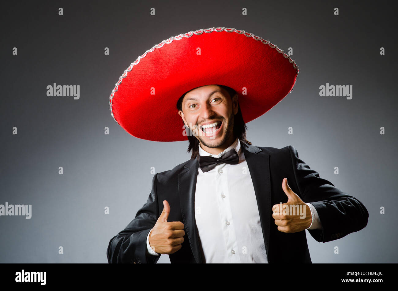 Young mexican man wearing sombrero Stock Photo - Alamy