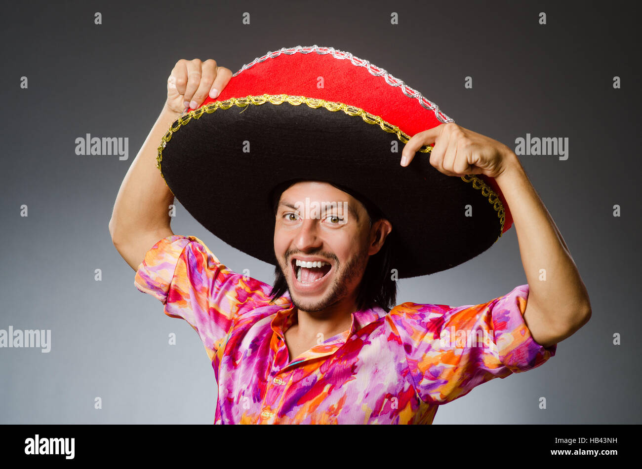 Young mexican man wearing sombrero Stock Photo - Alamy