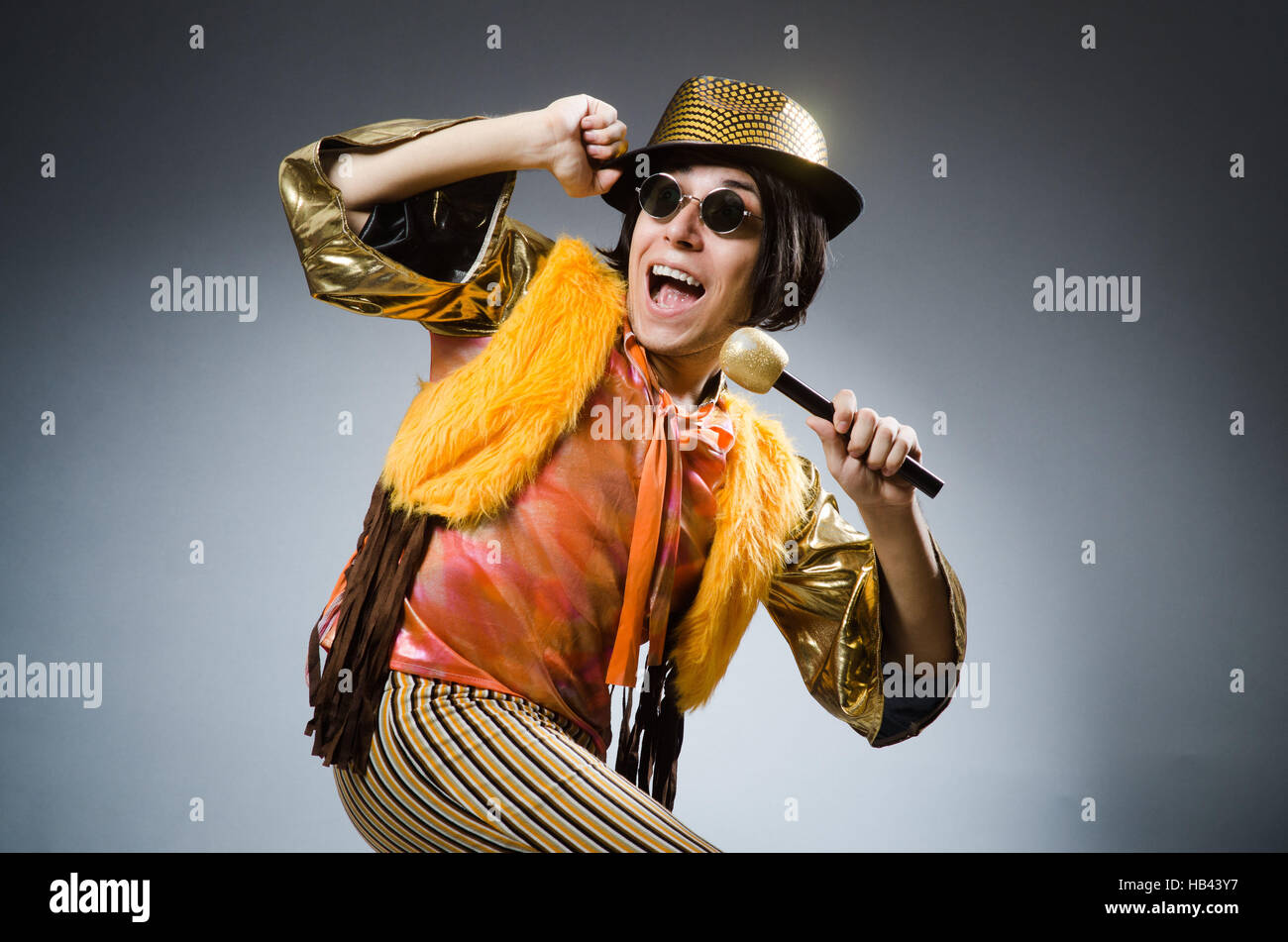 Young man singing in karaoke club Stock Photo - Alamy