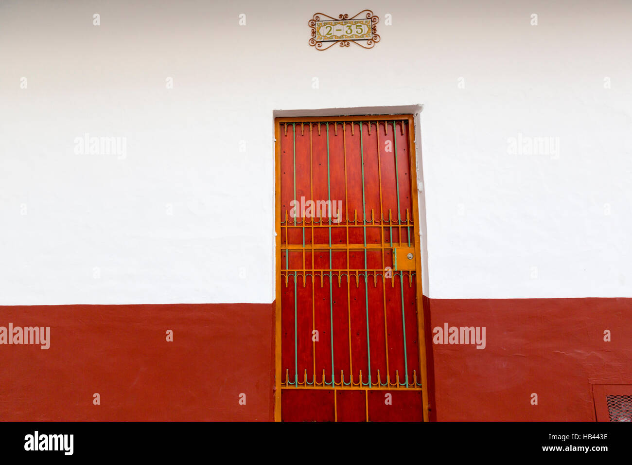 Colored wall and door, colonial architecture in Cali Stock Photo - Alamy