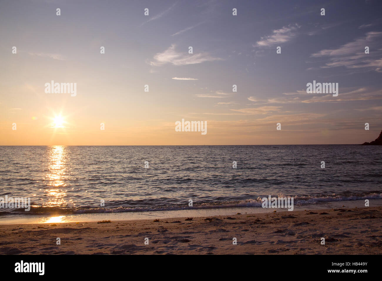 Sunset at the beach Stock Photo - Alamy