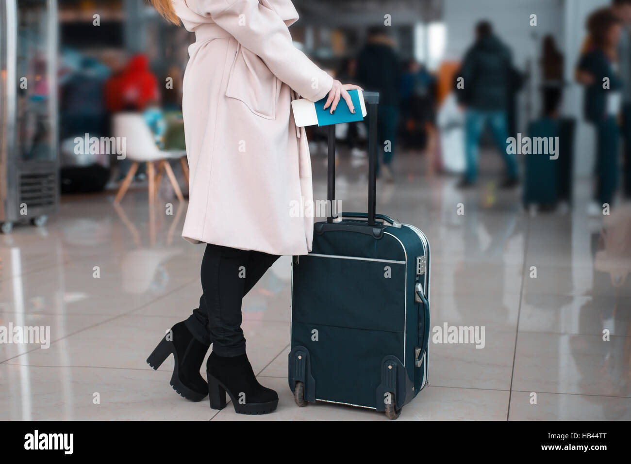 Legs of businesswoman with baggage in airport Stock Photo - Alamy