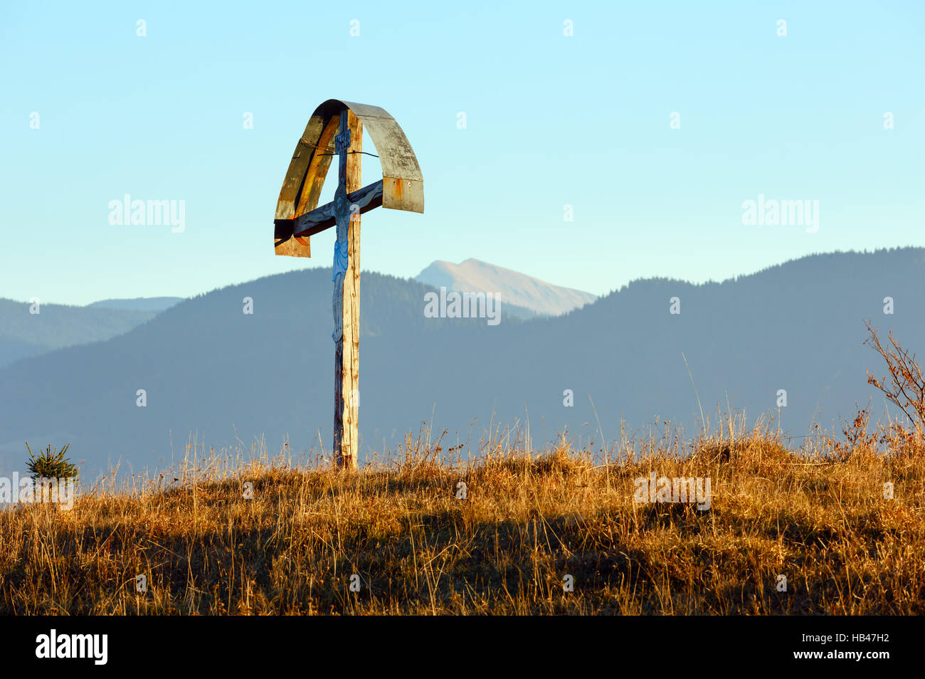 Wooden cross on autumn slope Stock Photo - Alamy