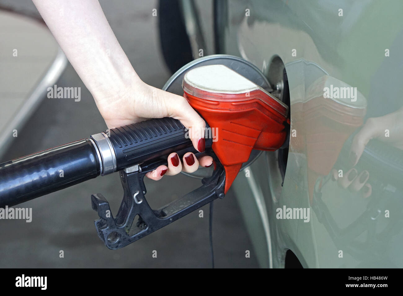 Woman filling car fuel filling hi-res stock photography and images - Alamy