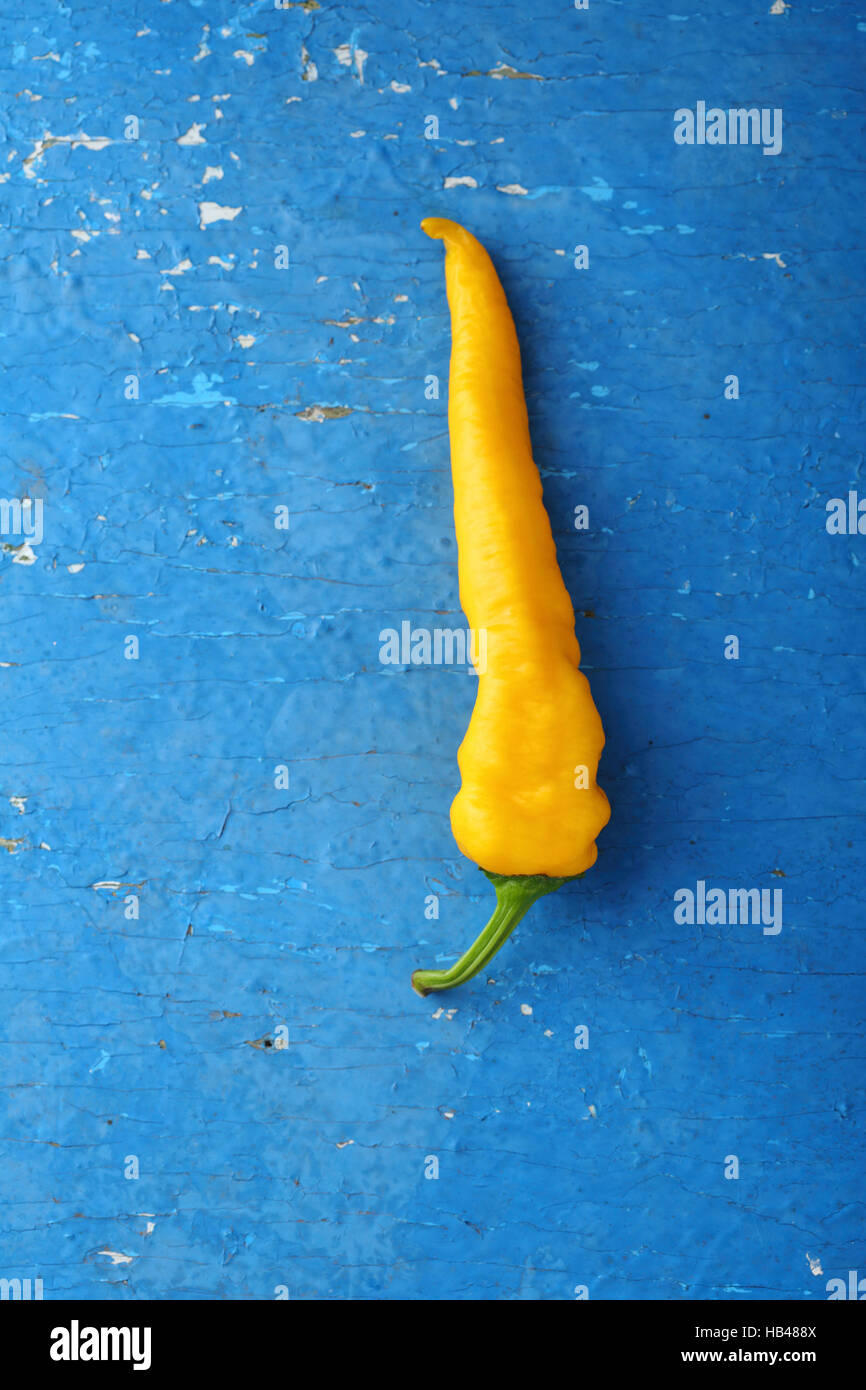 One yellow pepper on old wood, food top view Stock Photo - Alamy