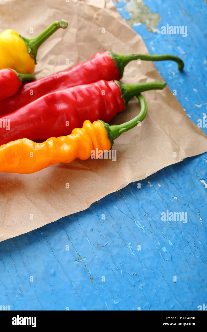 Spice pepper on craft paper, food closeup Stock Photo - Alamy