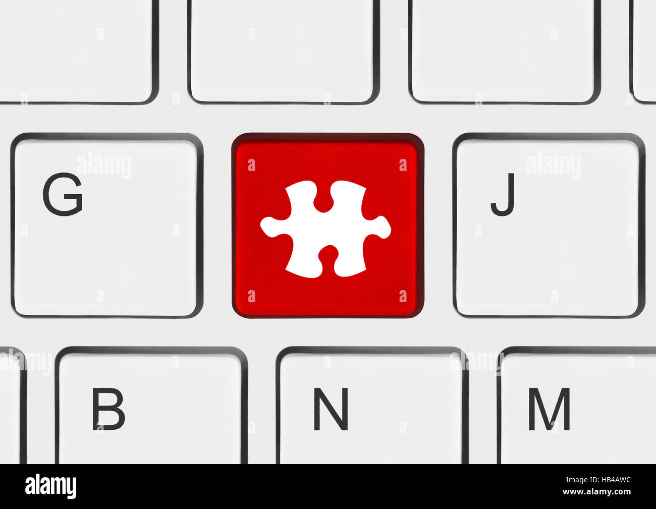 Computer keyboard with puzzle key Stock Photo - Alamy