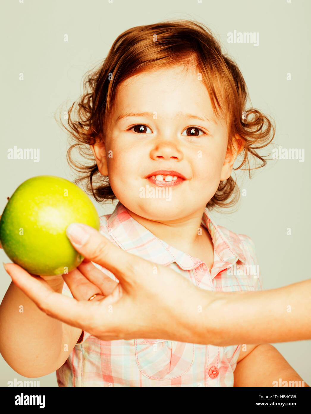 little cute baby girl pointing isolated on white close up with g Stock ...