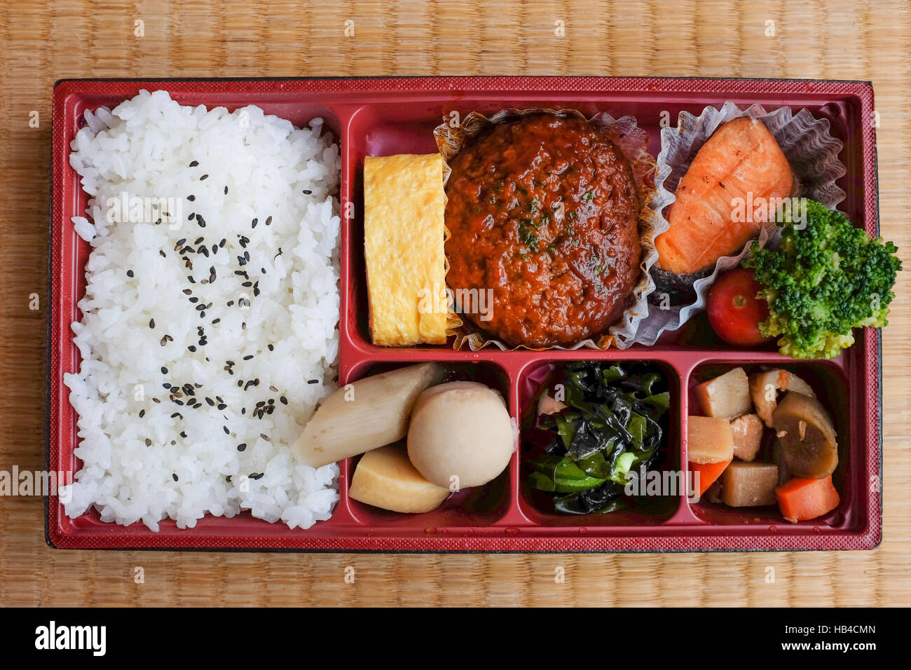 A Japanese "hamburg" bento (lunch box), including rice, a hamburger ...
