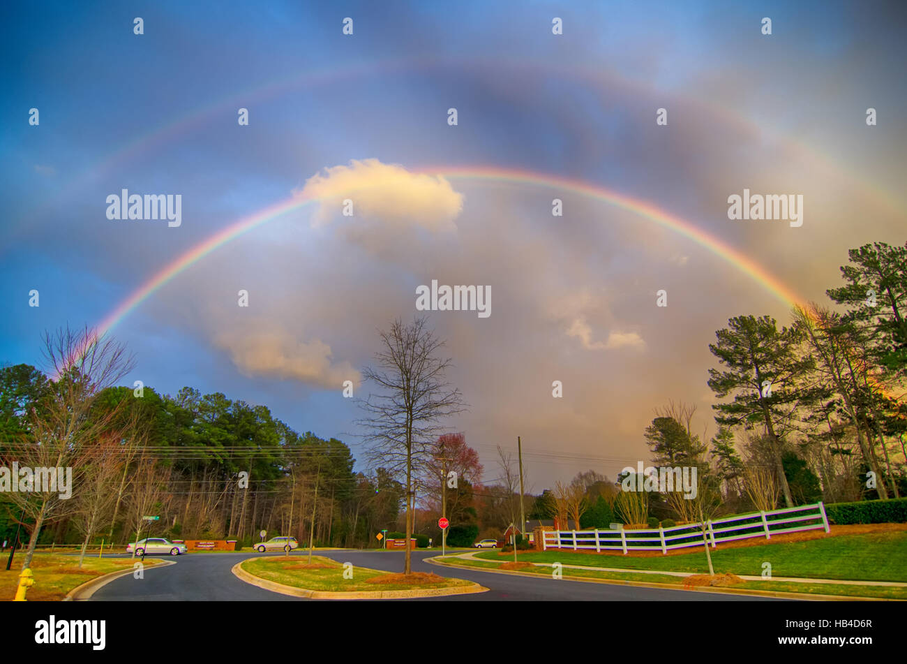 rainbow colors over country roads Stock Photo - Alamy
