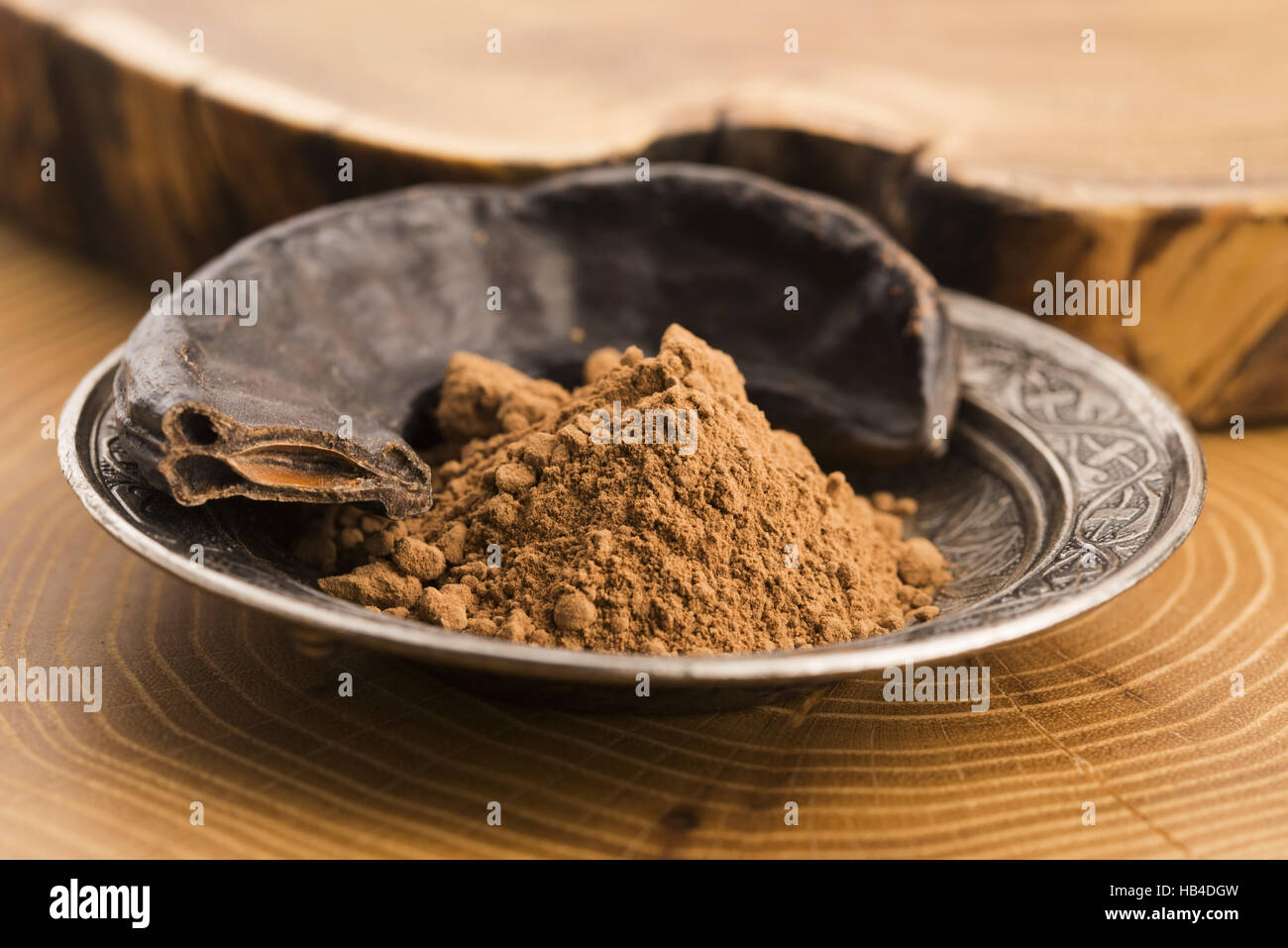 carob pods and carob powder Stock Photo - Alamy