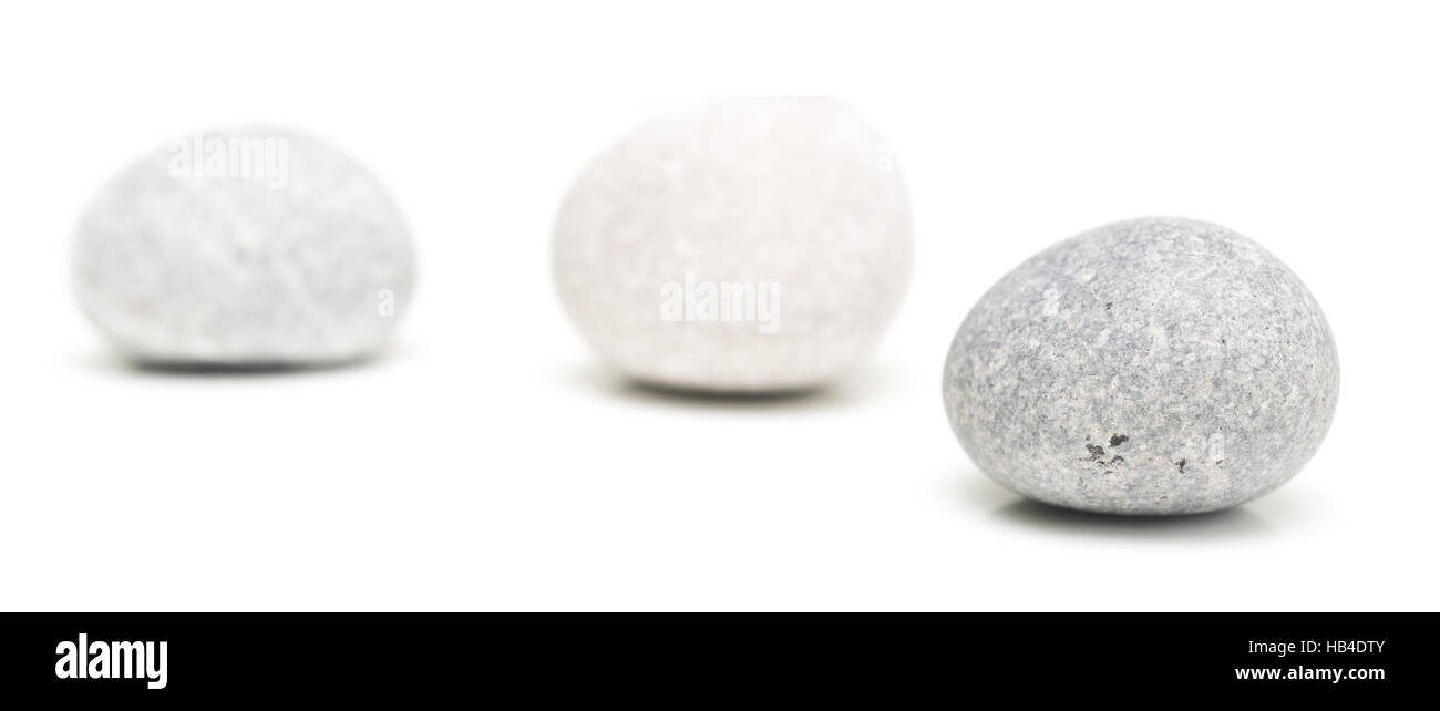 round stones on white Stock Photo - Alamy
