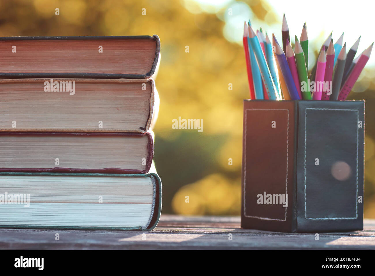 autumn book stack wooden outdoor Stock Photo - Alamy