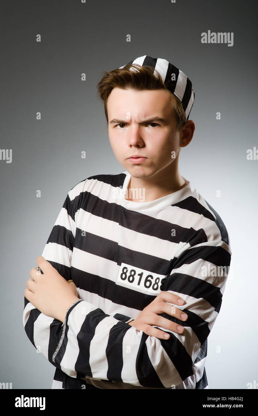 Funny prisoner in prison concept Stock Photo - Alamy