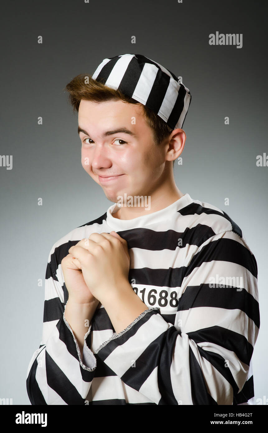 Funny prisoner in prison concept Stock Photo - Alamy