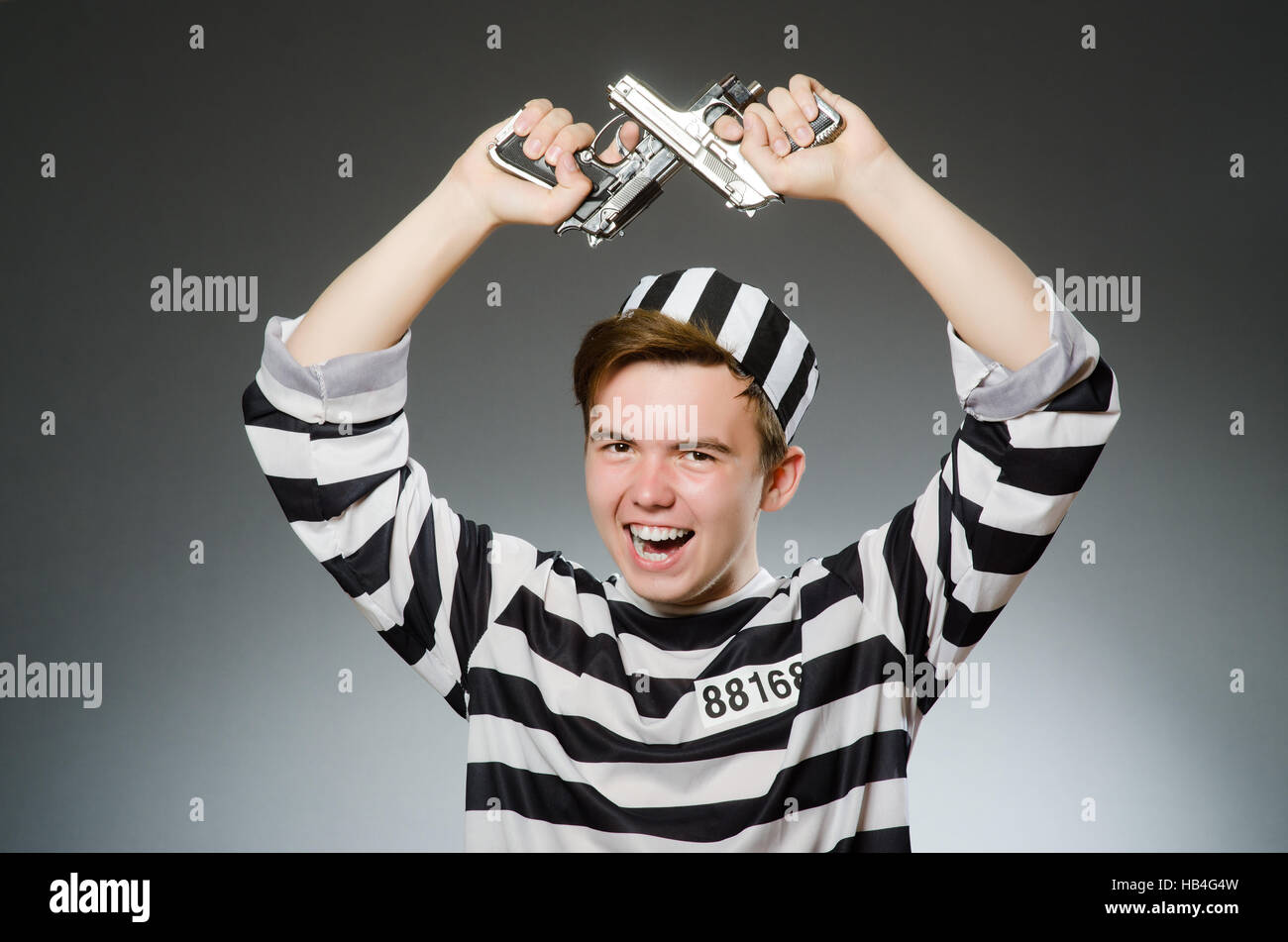 Funny prisoner in prison concept Stock Photo - Alamy