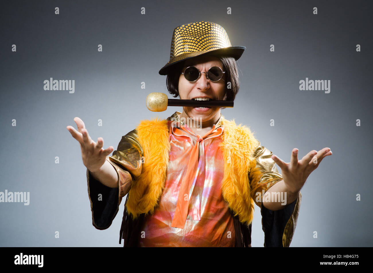 Young man singing in karaoke club Stock Photo - Alamy