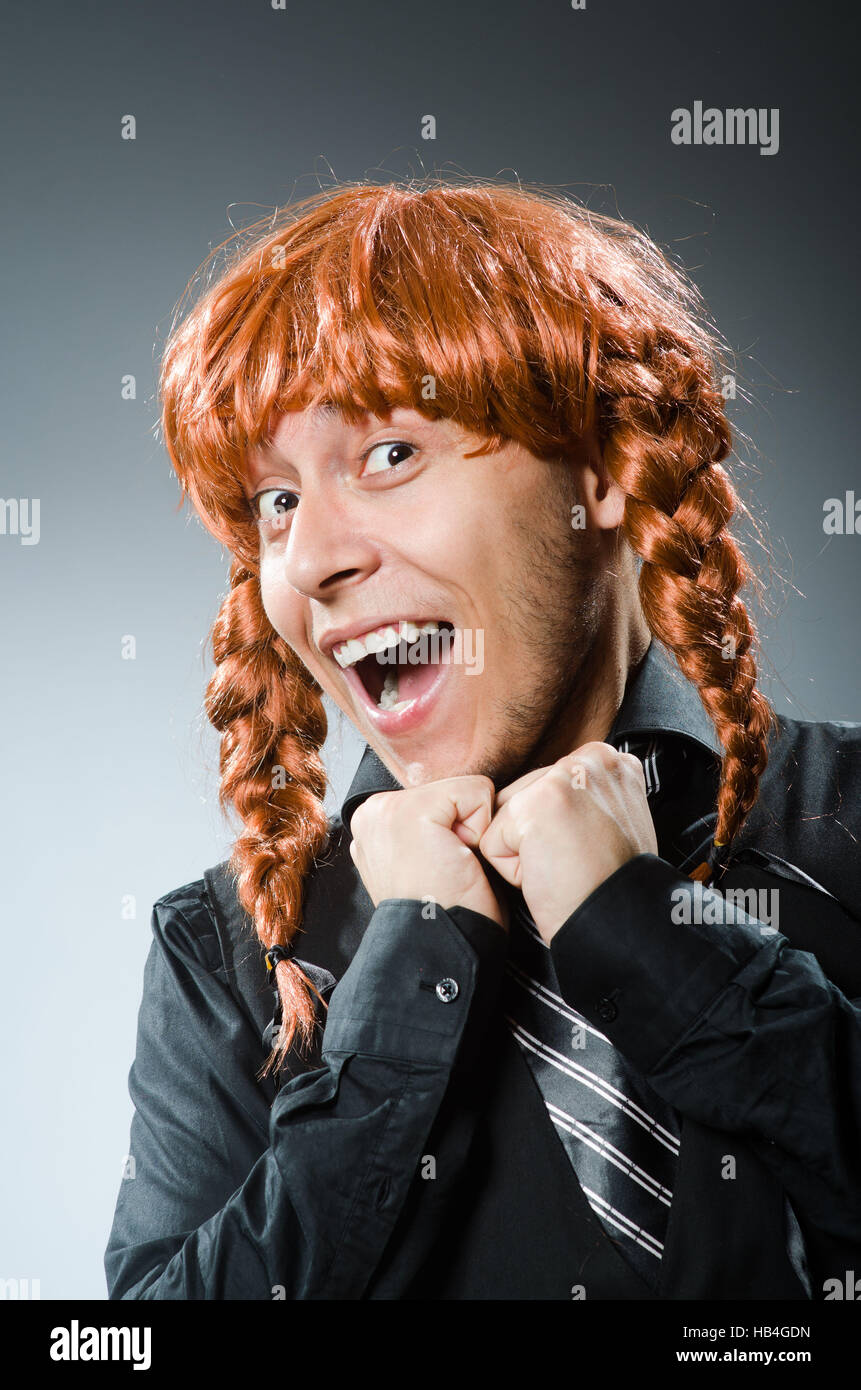 Funny man with red hair wig Stock Photo - Alamy