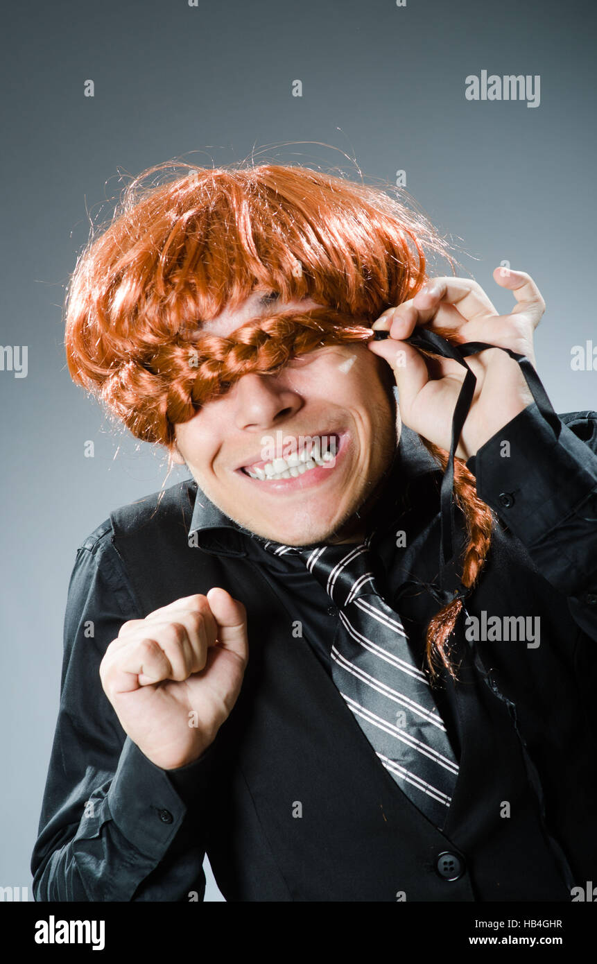 Funny man with red hair wig Stock Photo - Alamy