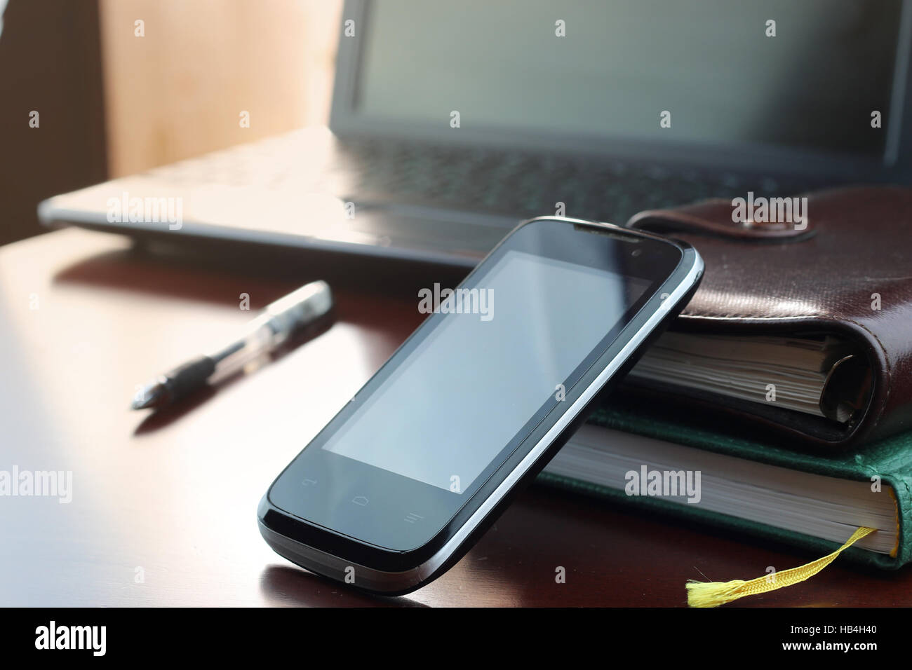 office desk with a computer and a telephone diary Stock Photo - Alamy