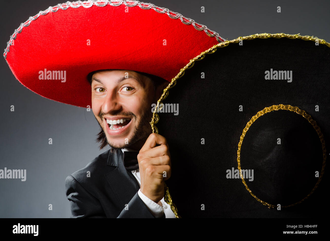Young mexican man wearing sombrero Stock Photo - Alamy