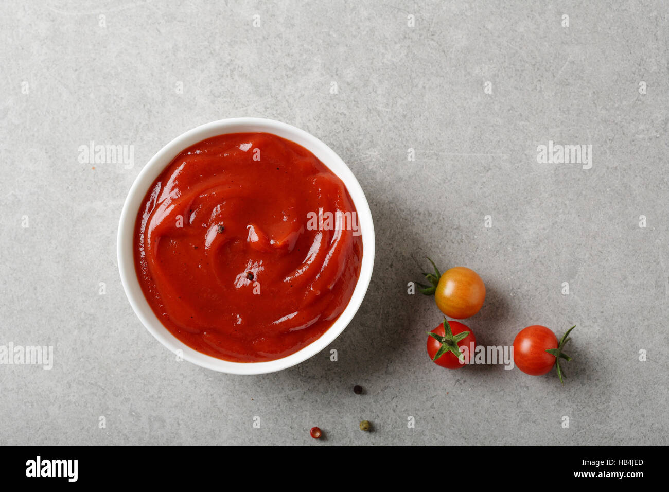 Small bowl with spice tomato sauce, food top view Stock Photo - Alamy