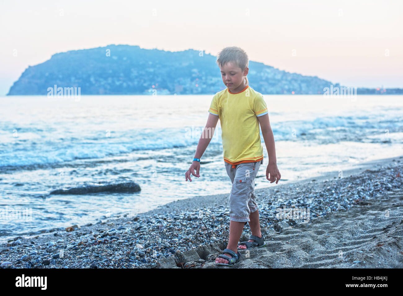 Kid boy walking Stock Photo - Alamy