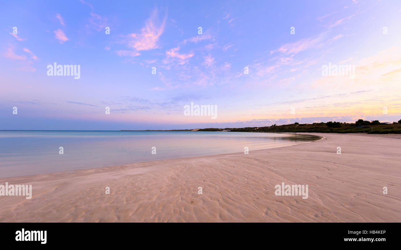Coral Bay beach at sunrise Stock Photo - Alamy