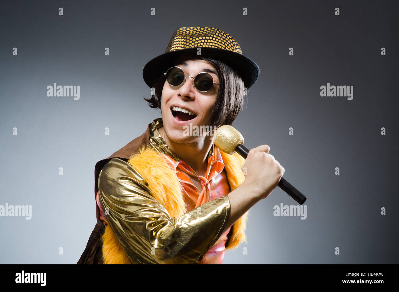 Young man singing in karaoke club Stock Photo - Alamy