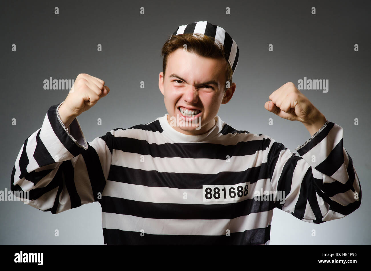 Funny prisoner in prison concept Stock Photo - Alamy