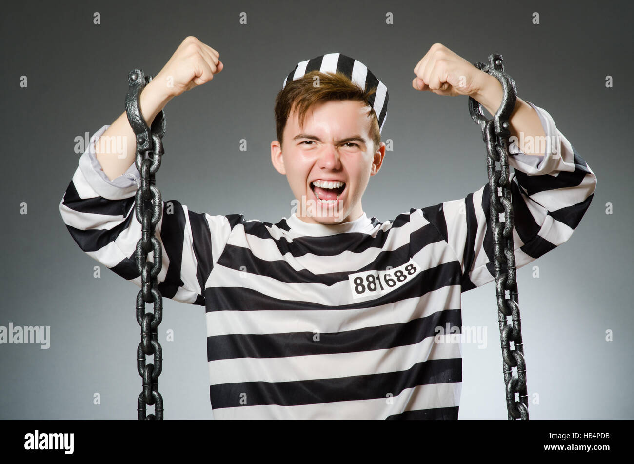 Funny prisoner in prison concept Stock Photo - Alamy