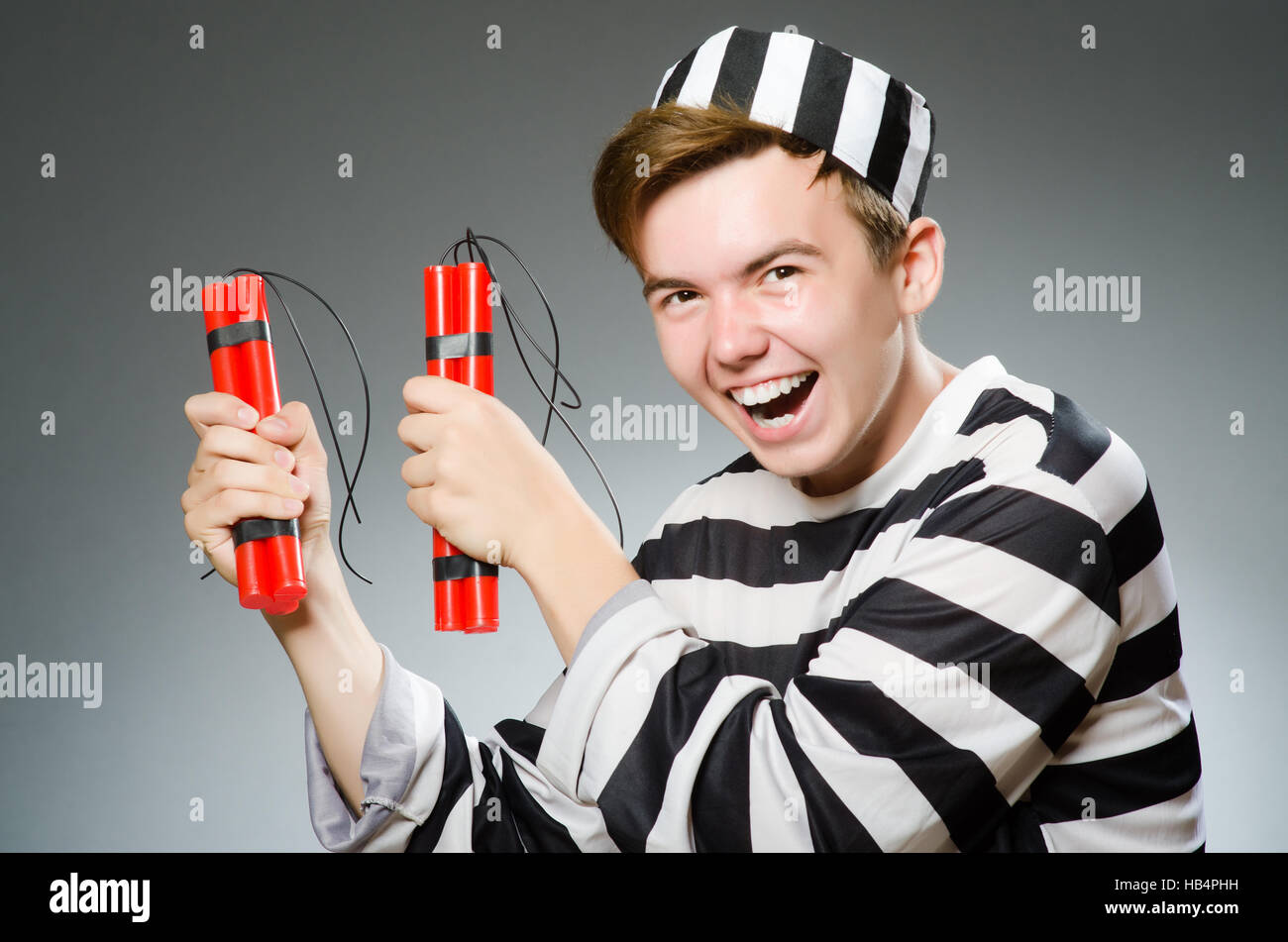 Funny prisoner in prison concept Stock Photo - Alamy