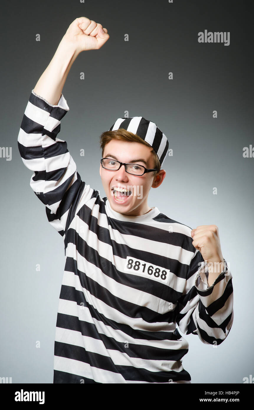 Funny prisoner in prison concept Stock Photo - Alamy
