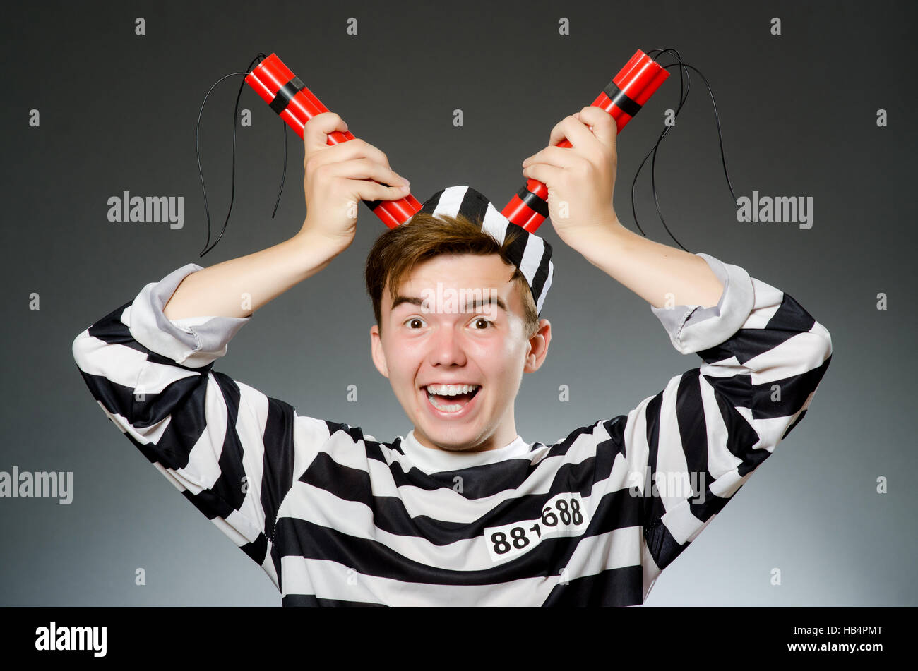 Funny prisoner in prison concept Stock Photo - Alamy
