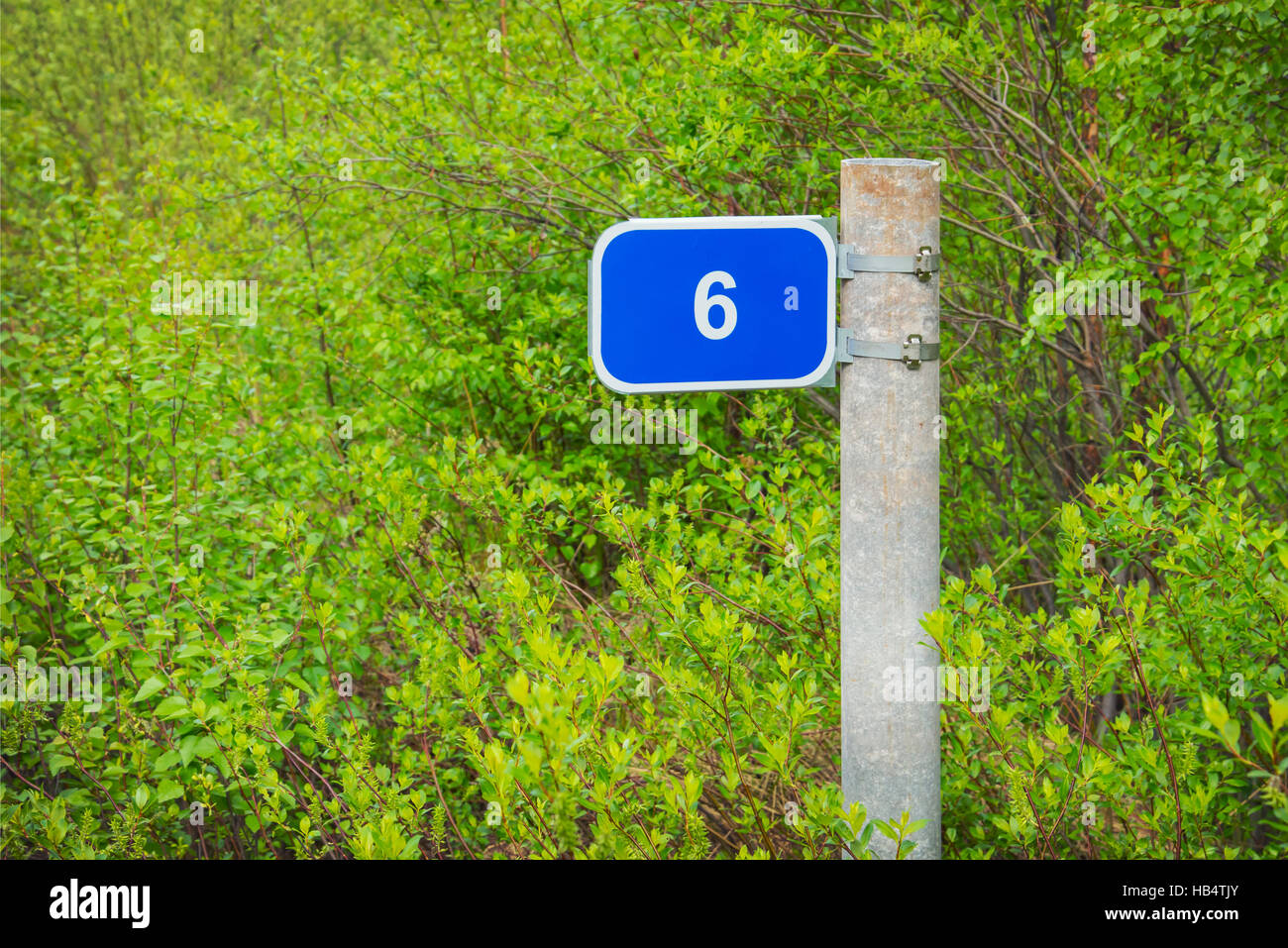 Milepost mileage kilometrs on the roadside Stock Photo - Alamy