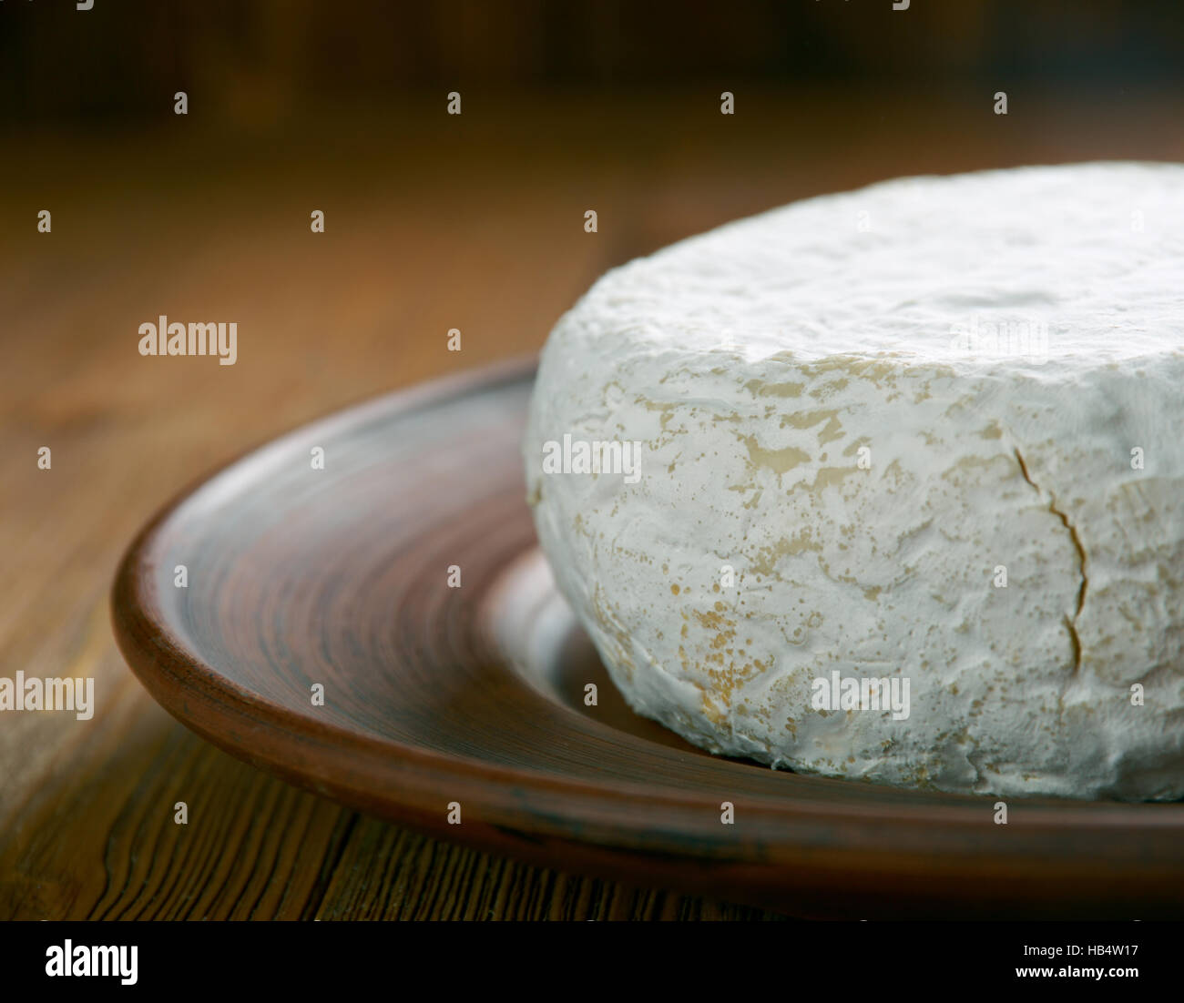 Round Brie cheese Stock Photo - Alamy