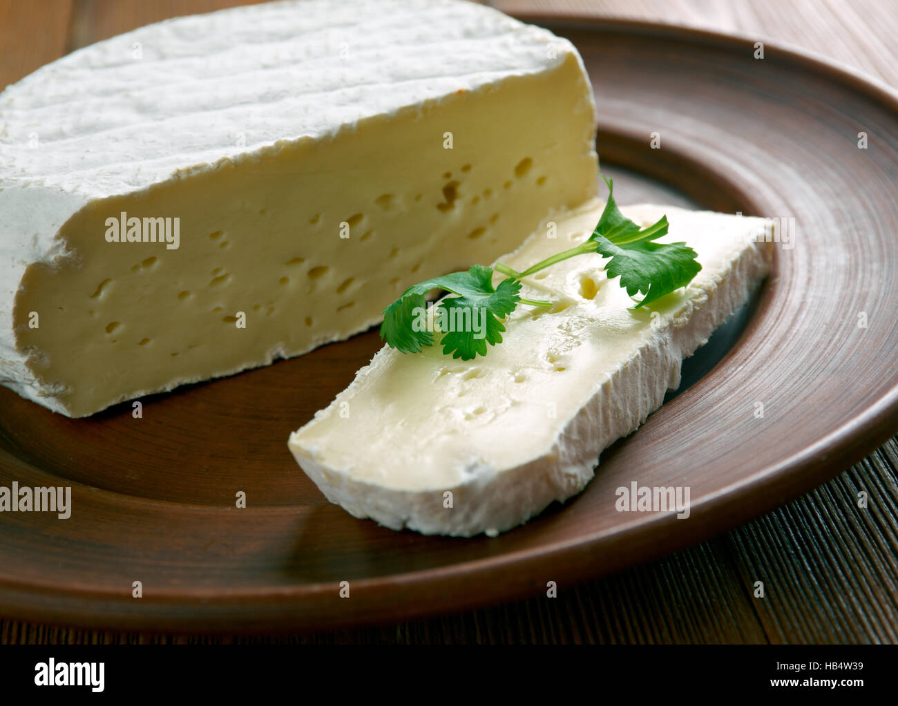Round Brie cheese Stock Photo - Alamy
