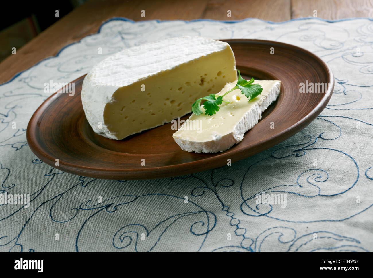 Round Brie cheese Stock Photo - Alamy